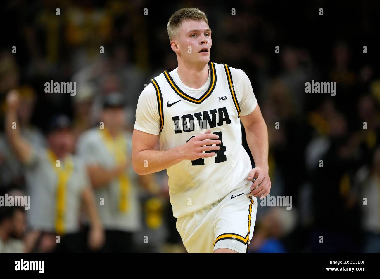 Iowa guard Bennett Stirtz runs up court after making a three-point ...