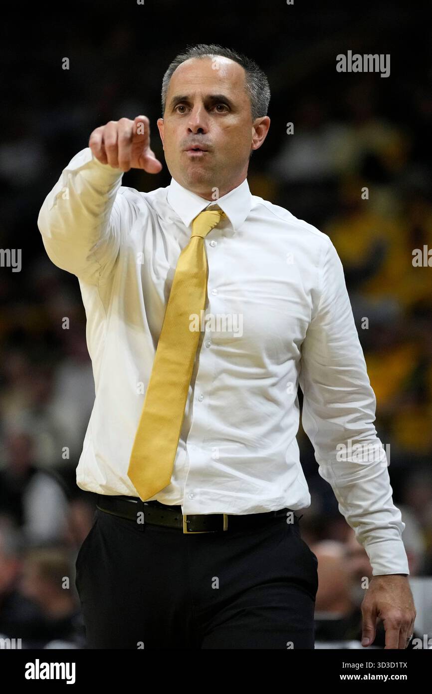 Iowa head coach Ben McCollum directs his team during the second half of ...