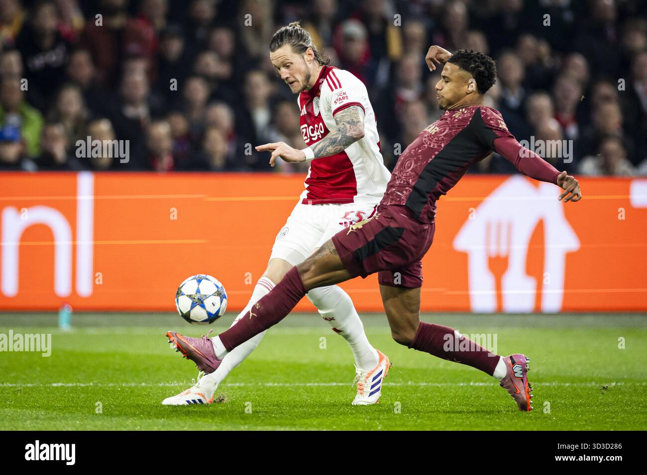 AMSTERDAM – (l-r) Wout Weghorst of Ajax, Ismail Jakobs of Galatasaray during the UEFA Champions ...