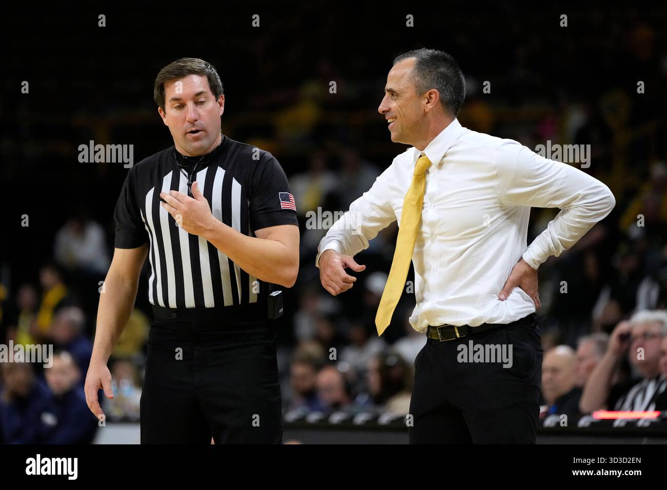 Iowa head coach Ben McCollum talks with an official during the second ...