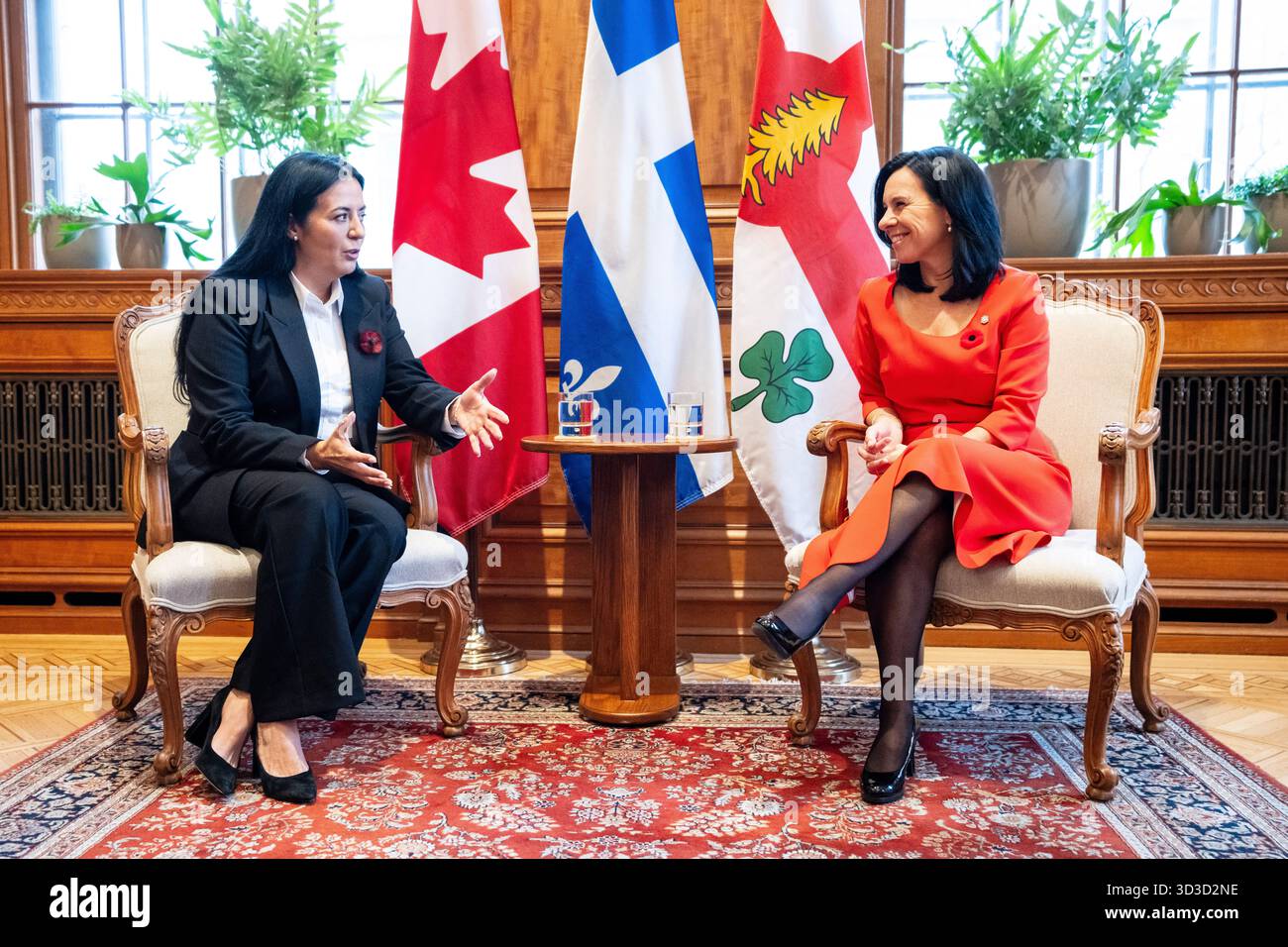 Outgoing Montreal mayor Valerie Plante, right, speaks with new mayor ...