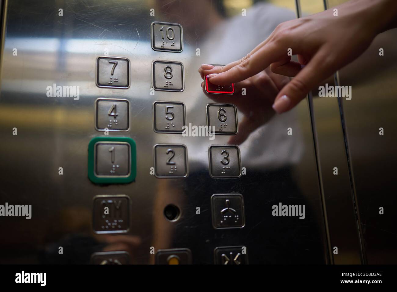 A video displaying a closeup view of someone pushing elevator buttons ...