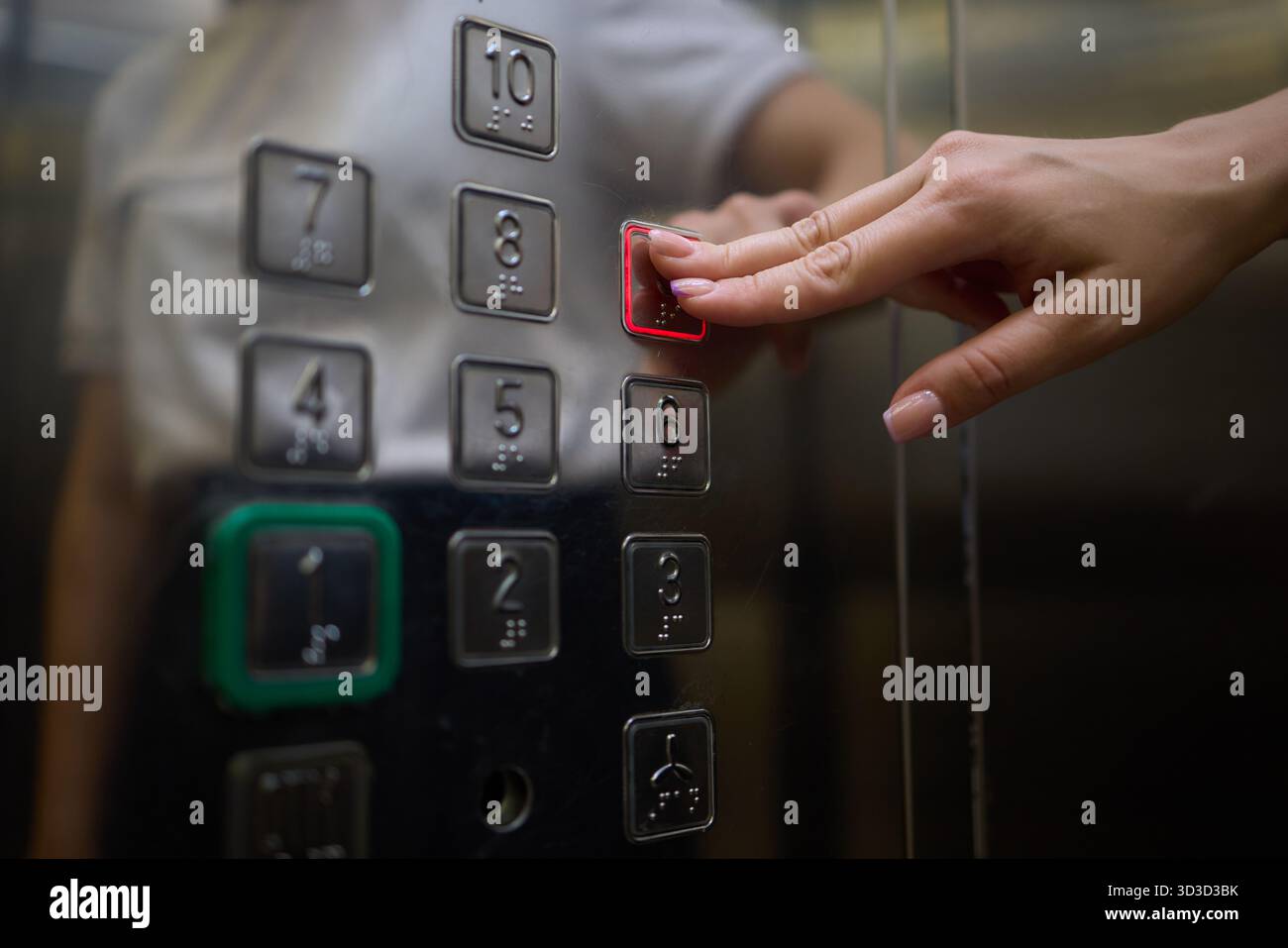 A video displaying a closeup view of someone pushing elevator buttons ...