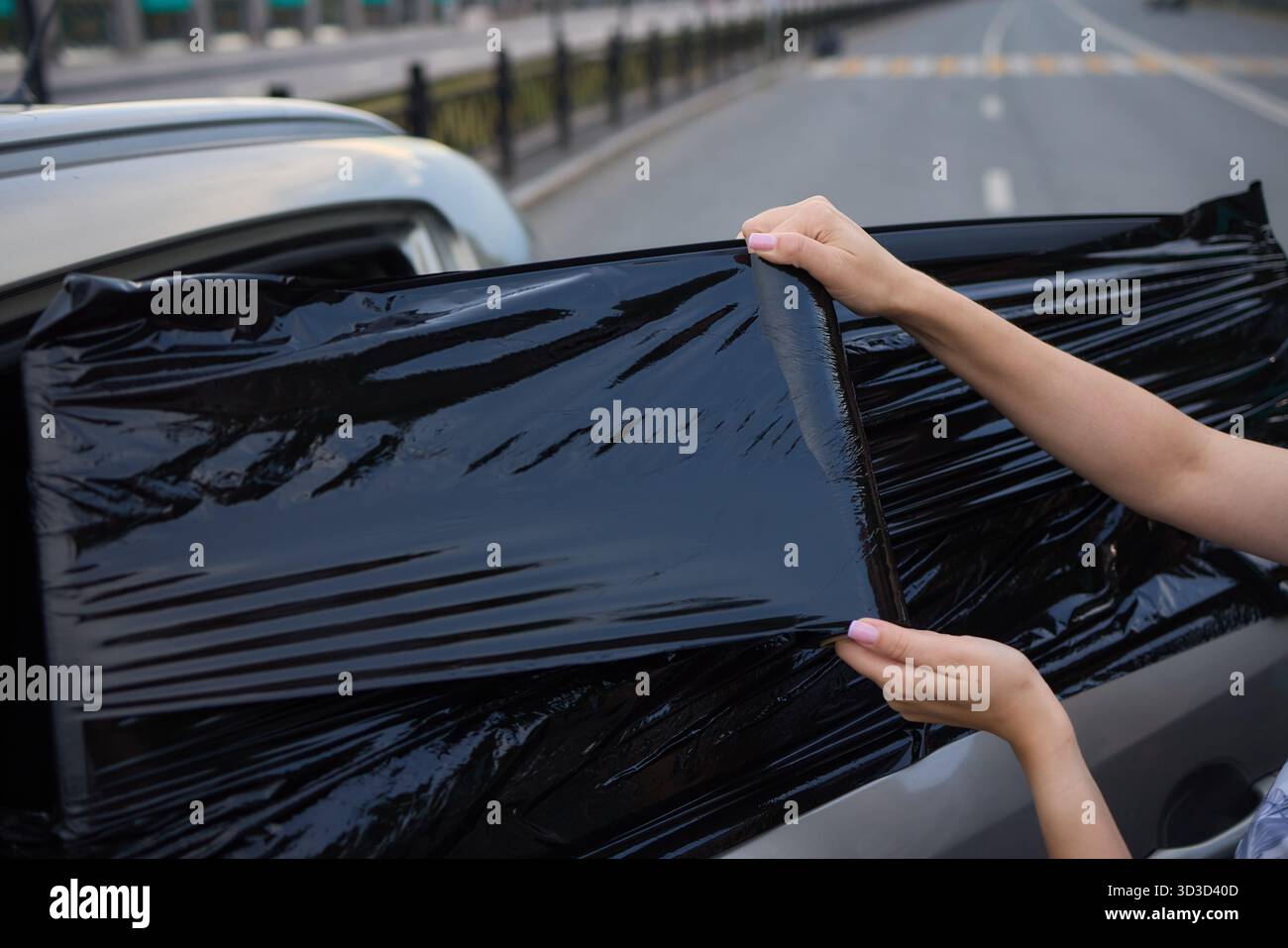 In an emergency, cover broken car window with duct tape for a quick ...