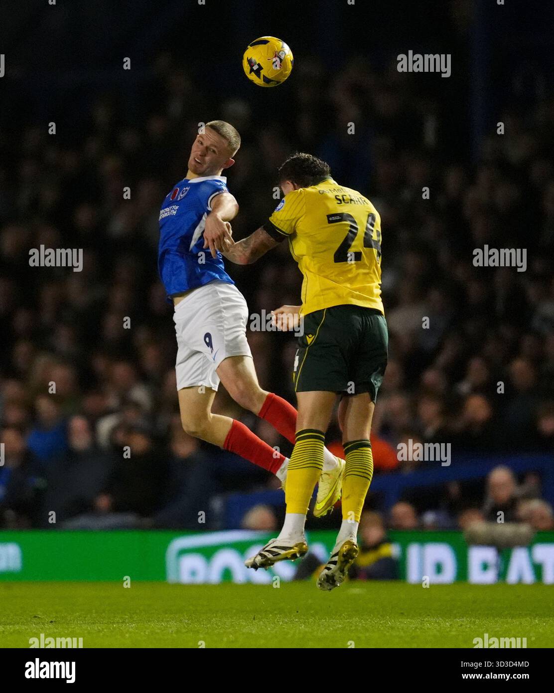 Portsmouth's Colby Bishop (left) and Wrexham's Dan Scarr battle for the ...