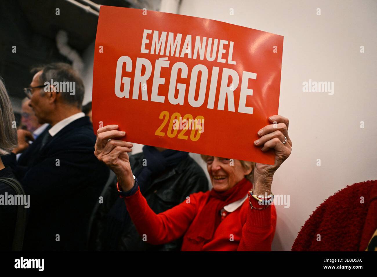 An attendee holds French candidate for mayor of Paris and MP for the ...
