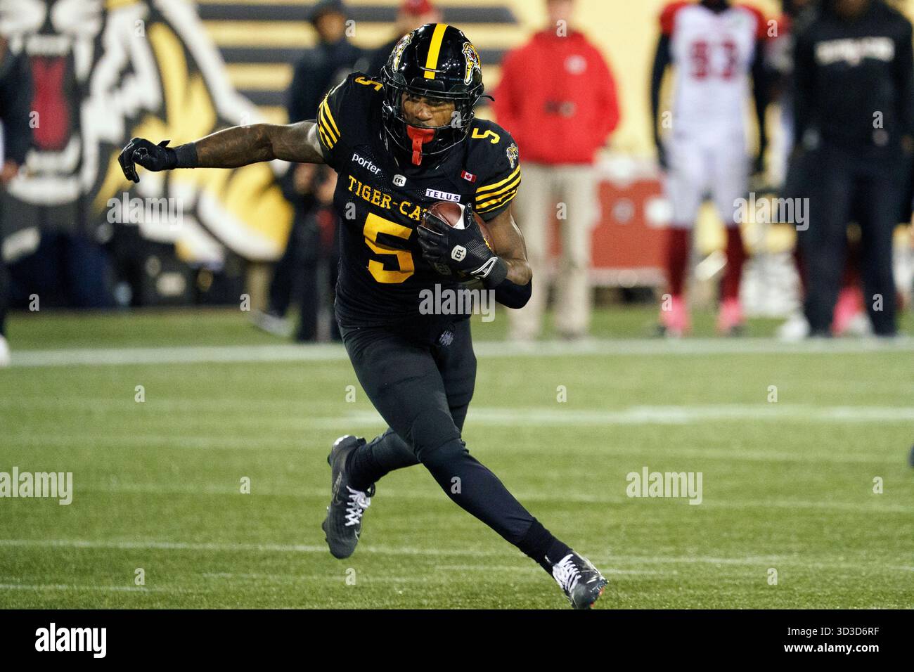 Hamilton Tiger-Cats running back Greg Bell (5) carries the ball during ...