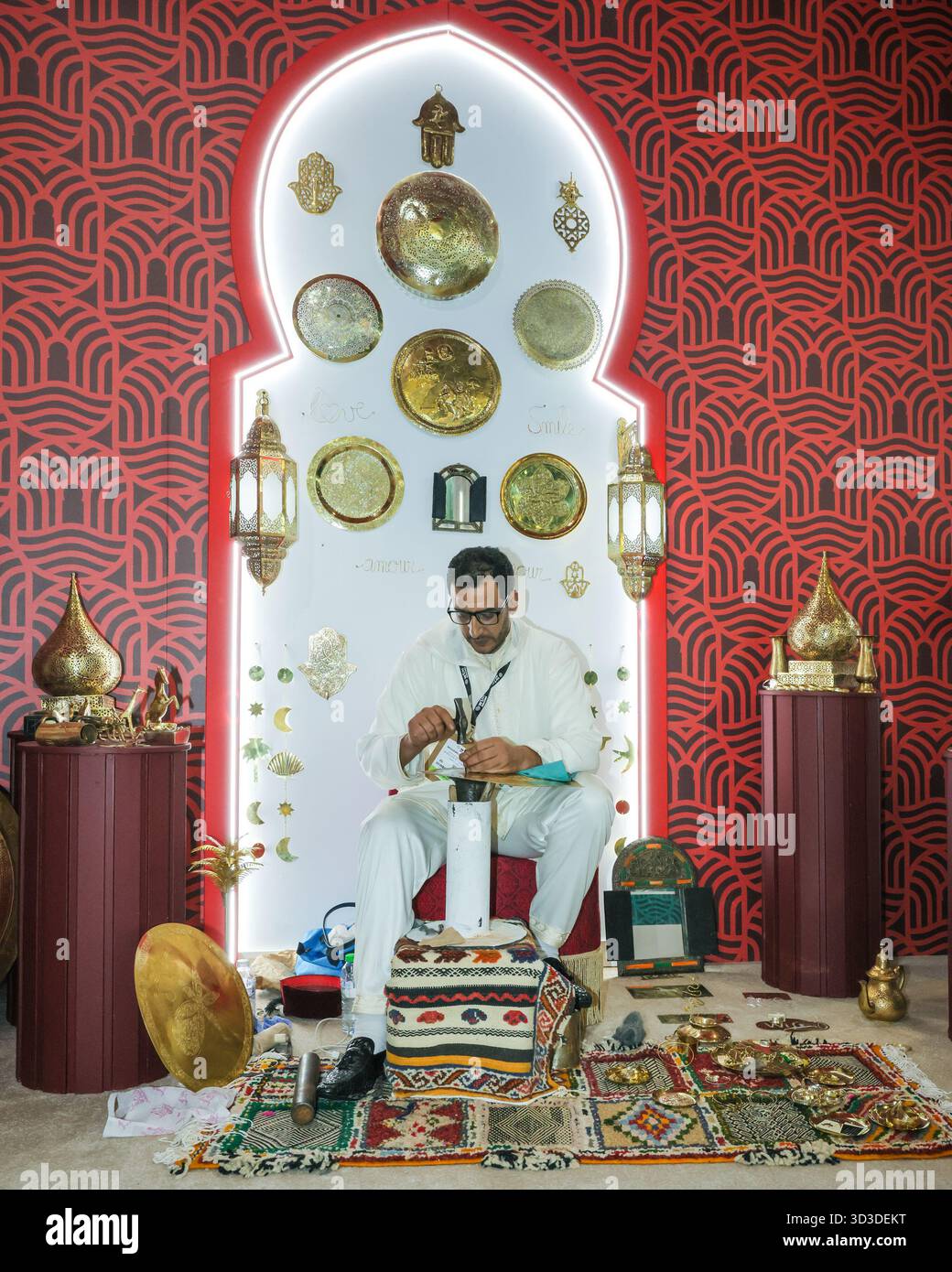 London, UK. 05th Nov, 2025. At the Morocco booth, a man demonstrates ...