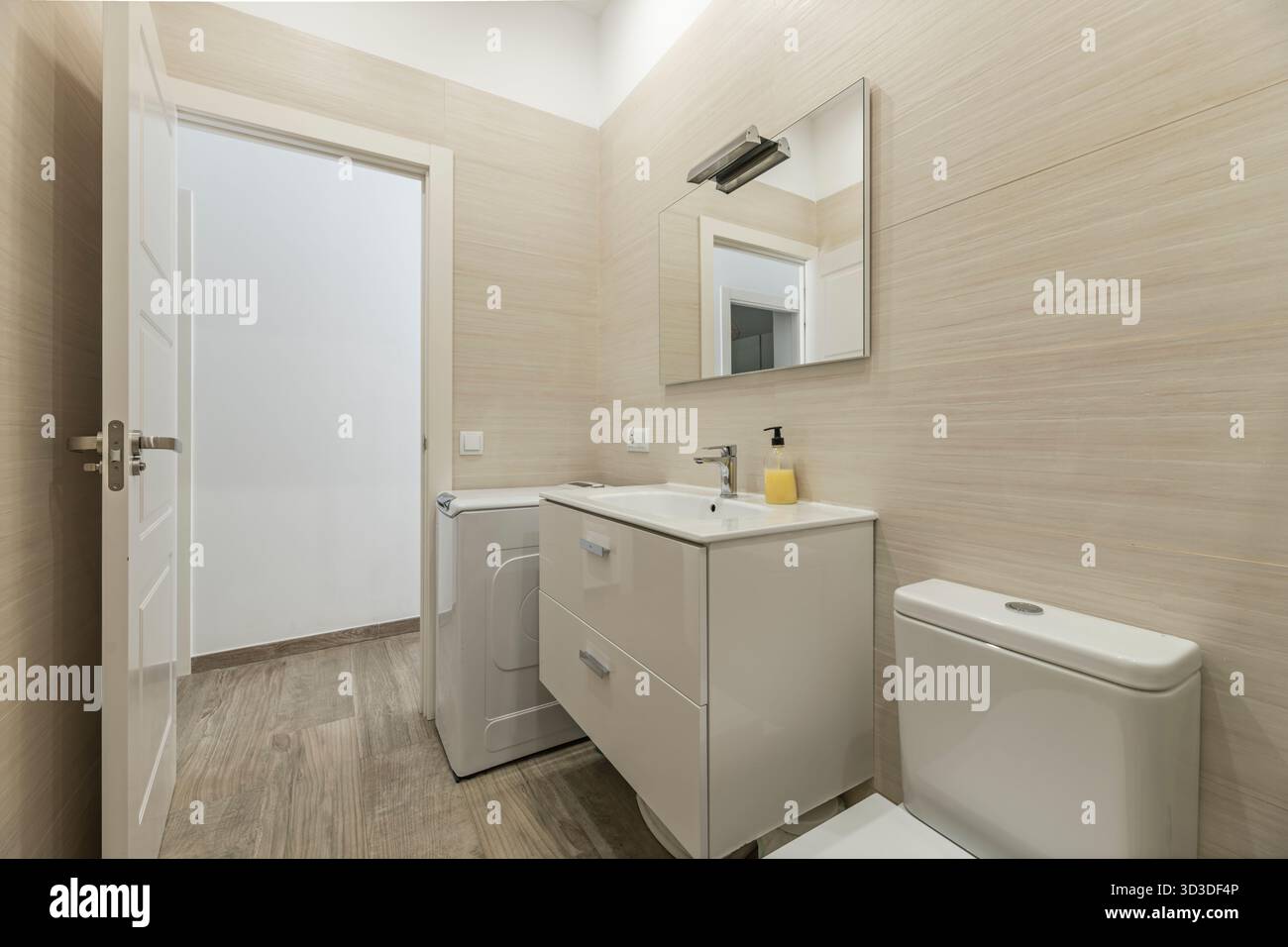 Modern bathroom with a shower enclosure without right angles, a built ...