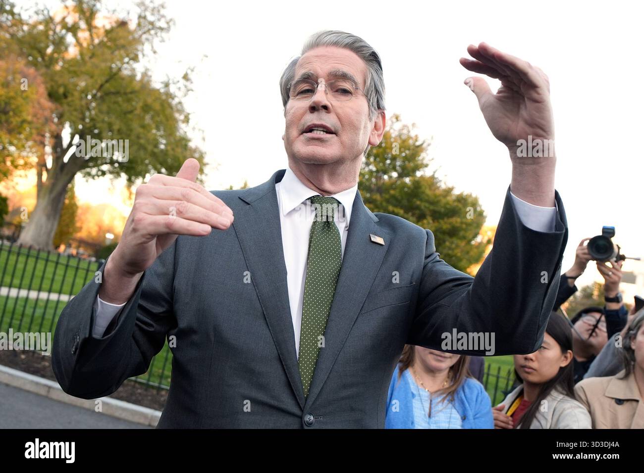 Treasury Secretary Scott Bessent talks to reporters outside the White ...