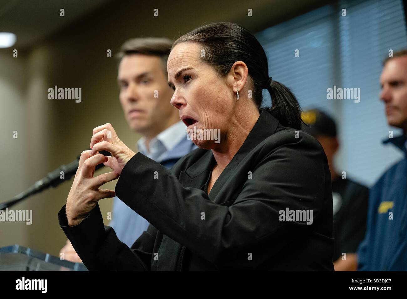 An ASL interpreter signs "mangled" as Kentucky Senate Minority Leader ...