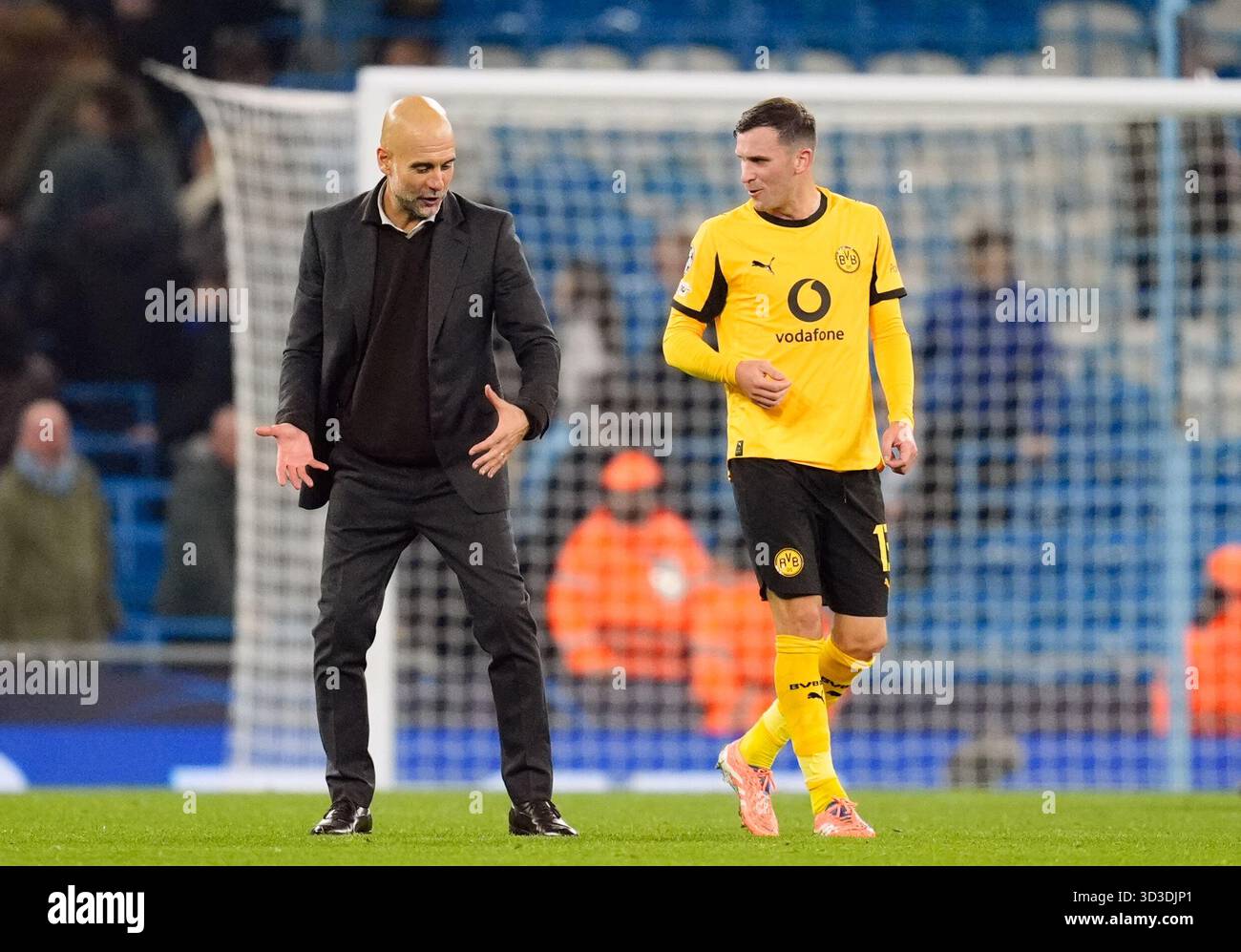 Borussia Dortmund's Pascal Gross with Manchester City manager Pep ...