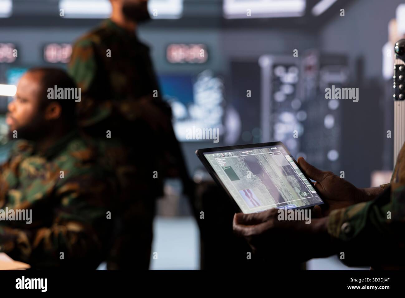 Military operator monitoring enemy aerial attacks using digital device ...