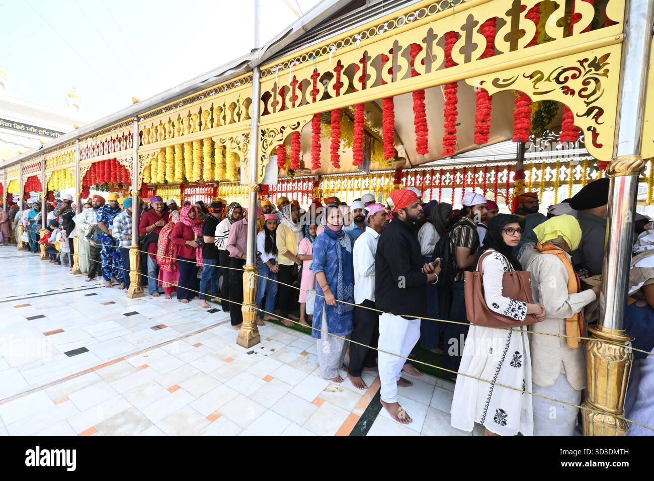 NEW DELHI, INDIA - NOVEMBER 5: Devotees offering prayer at Gurudwara ...
