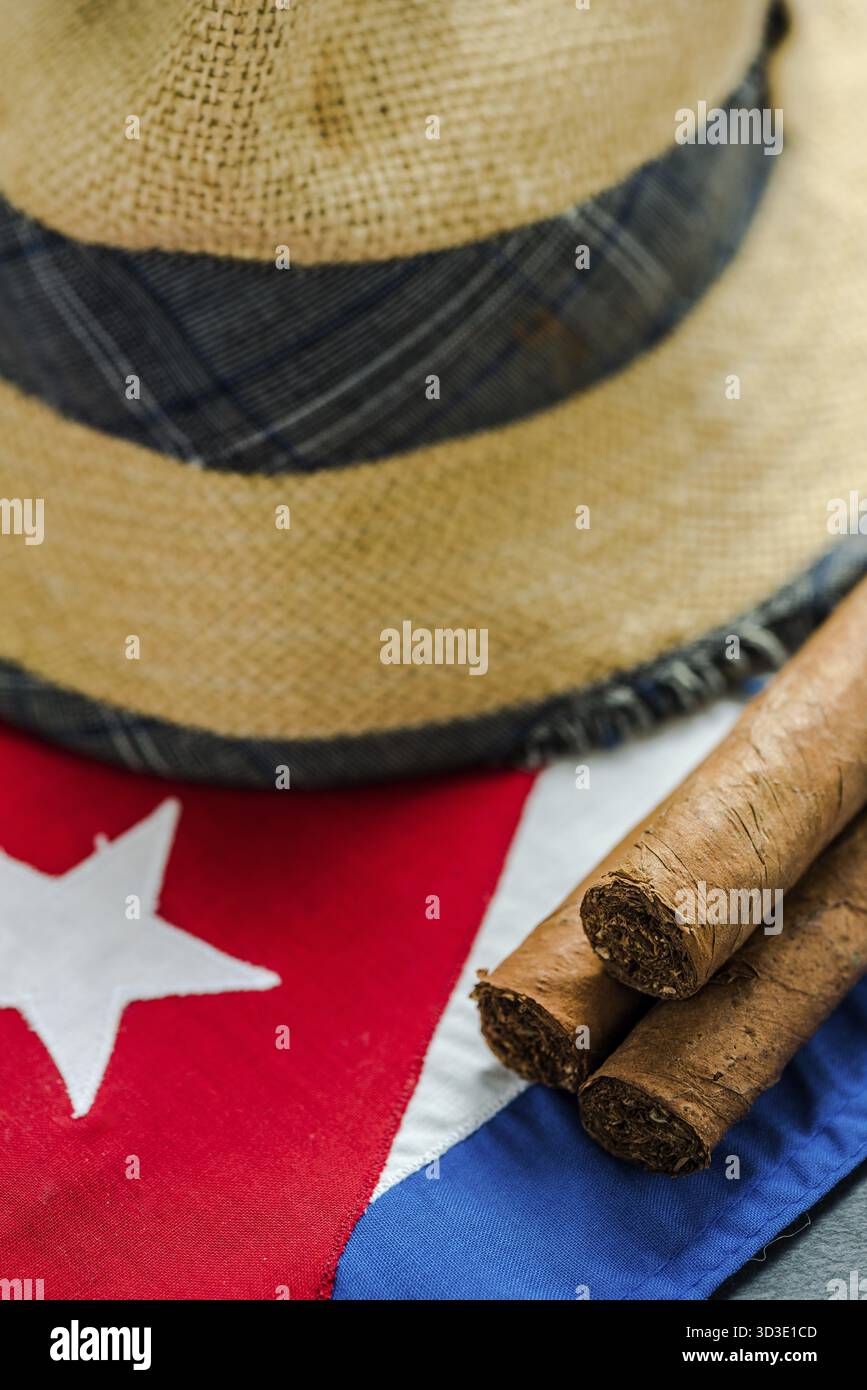 Traveling to Cuba concept background. National flag, straw hat and ...