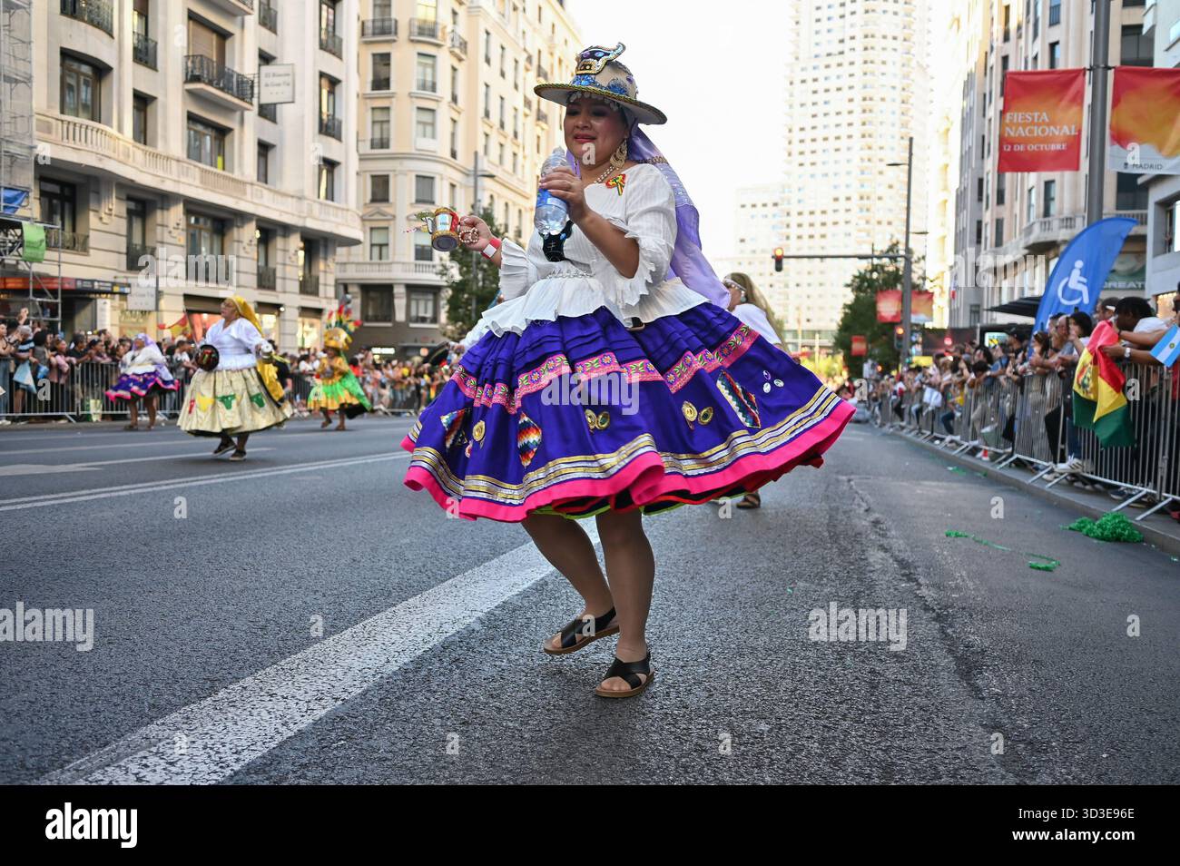 Several people dressed in traditional Latin American costumes during ...