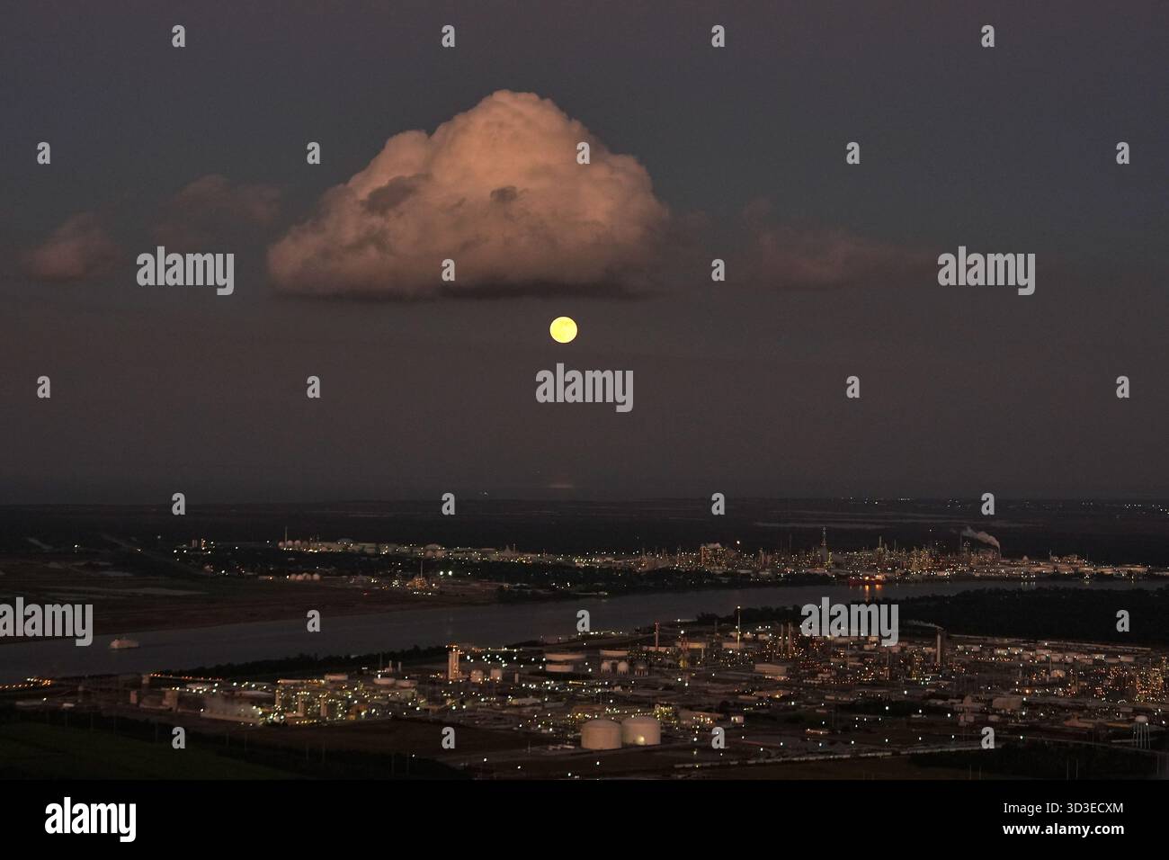 In this aerial photo, a supermoon rises above the Dow Chemical Plant ...