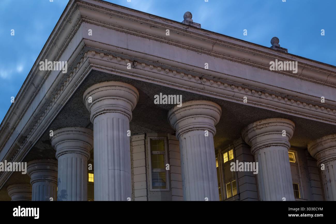 grand ionic columns support the cornice of a stately neoclassical ...