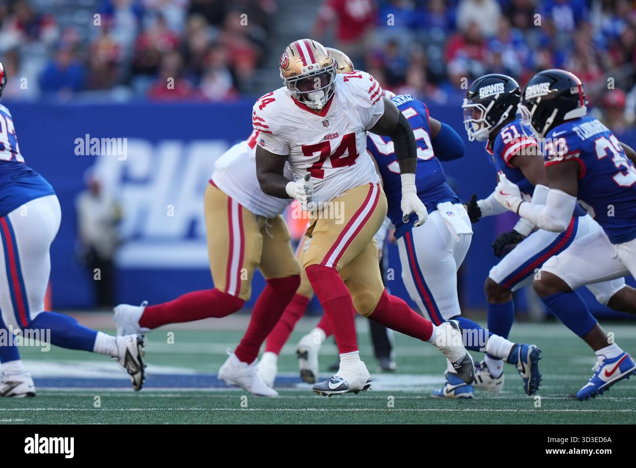 San Francisco 49ers offensive tackle Spencer Burford (74) runs blocks ...