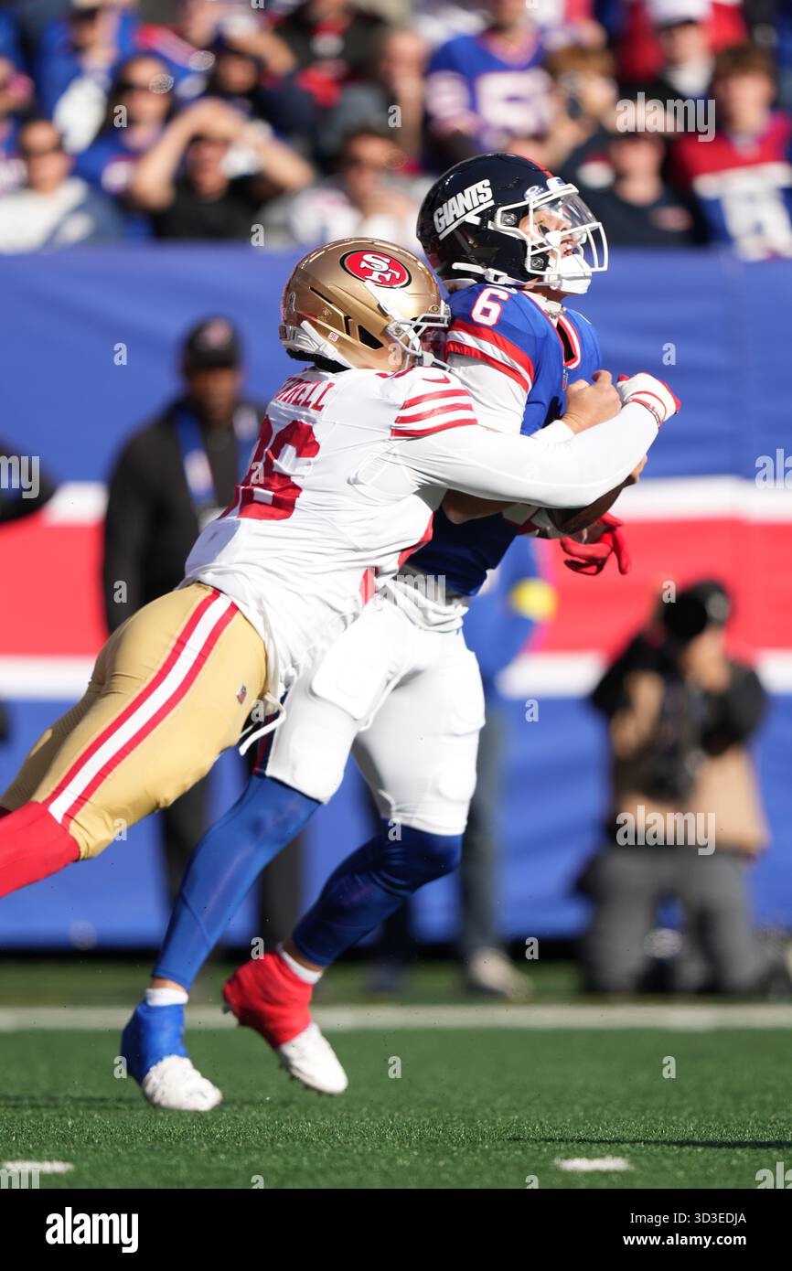 New York Giants quarterback Jaxson Dart (6) gets sacked from behind by ...