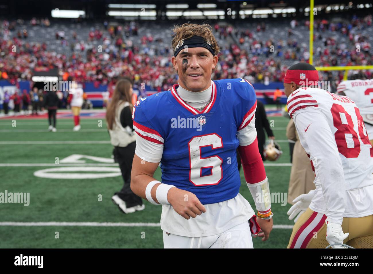 New York Giants quarterback Jaxson Dart (6) walks on the field ...