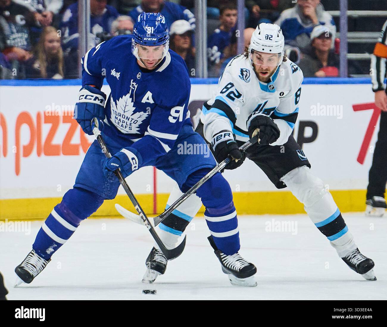 Toronto Maple Leafs' John Tavares (91) and Utah Mammoth's Kevin ...