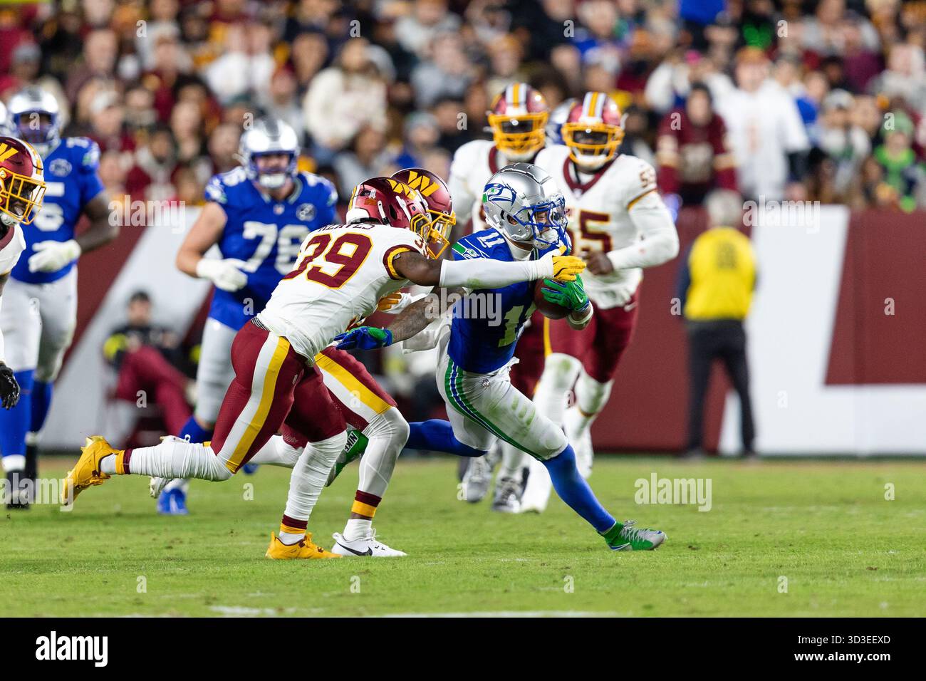 Washington Commanders safety Jeremy Reaves (39) makes the tackle ...