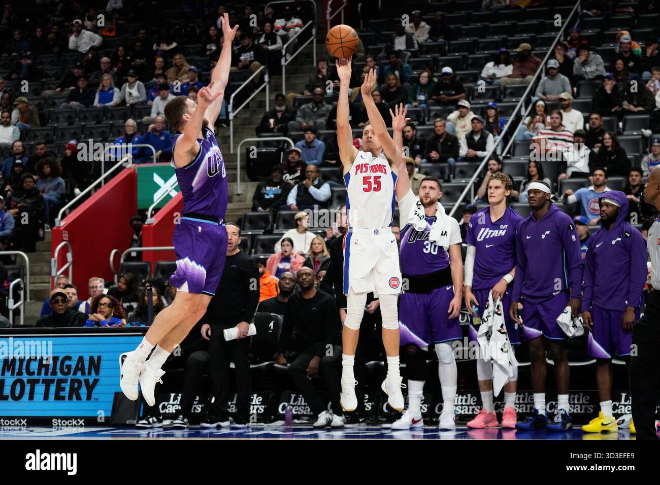 Detroit Pistons forward Duncan Robinson, right, shoots against Utah ...