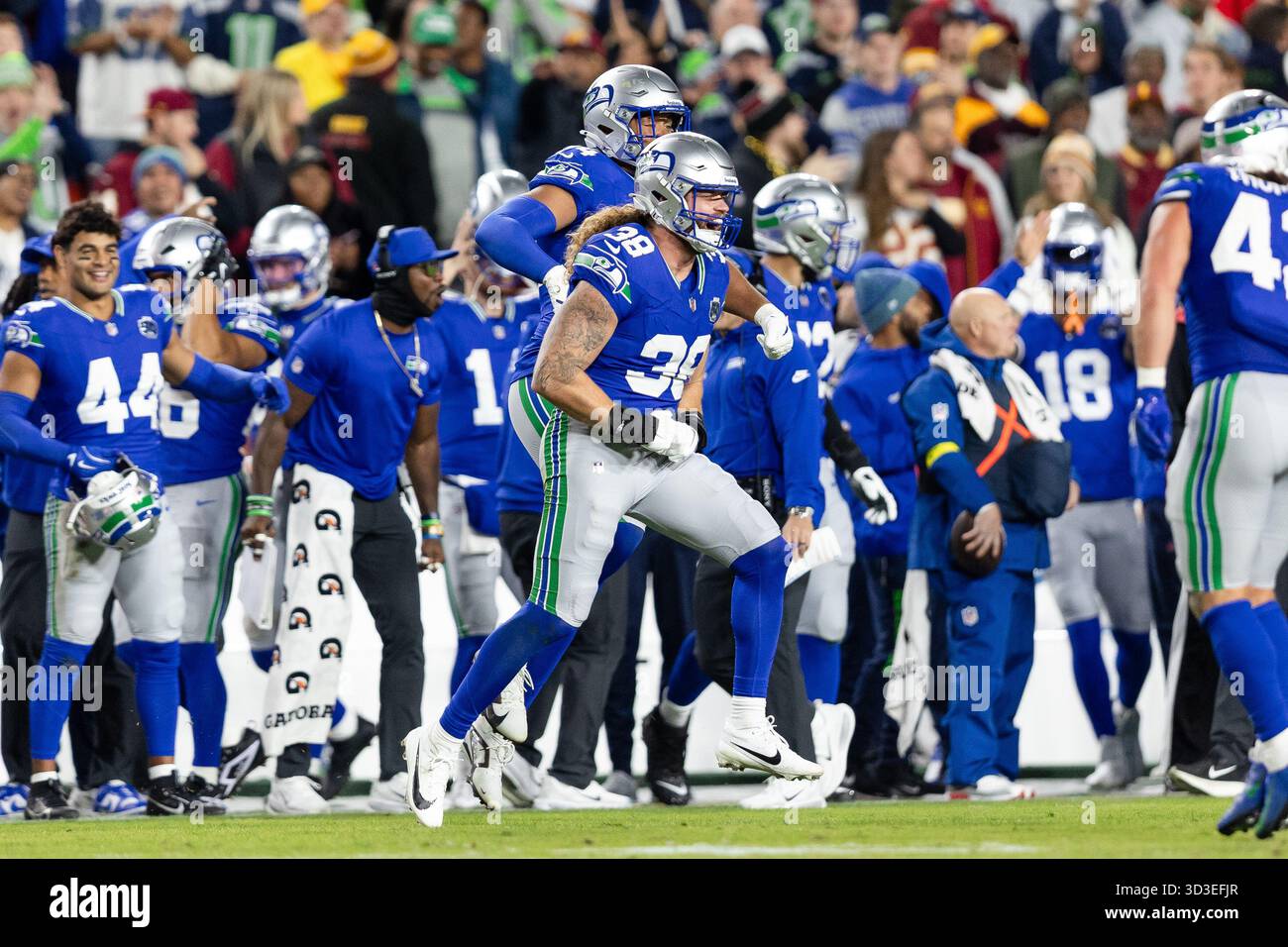 Seattle Seahawks safety Ty Okada (39) flexes picking off the pass by ...