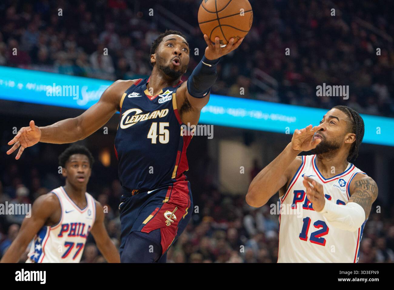 Cleveland Cavaliers' Donovan Mitchell (45) shoots as Philadelphia 76ers ...