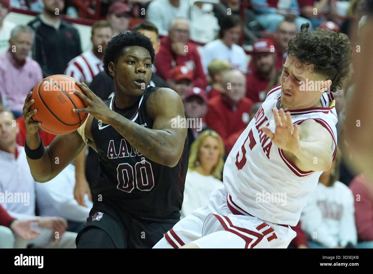 Alabama A&M's Kintavious Dozier (00) is fouled by Indiana's Conor ...