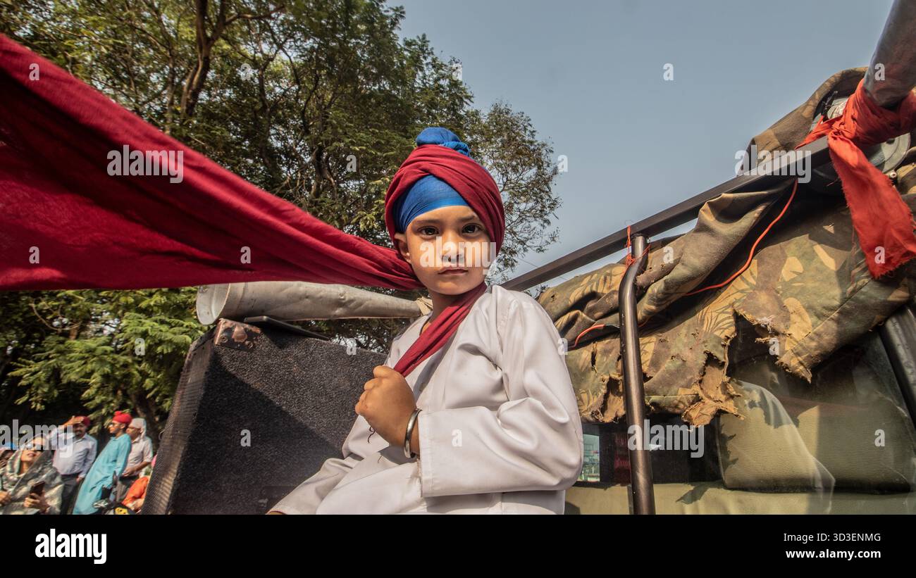 A Sikh child gets his turban tied during a turban seva (selfless ...