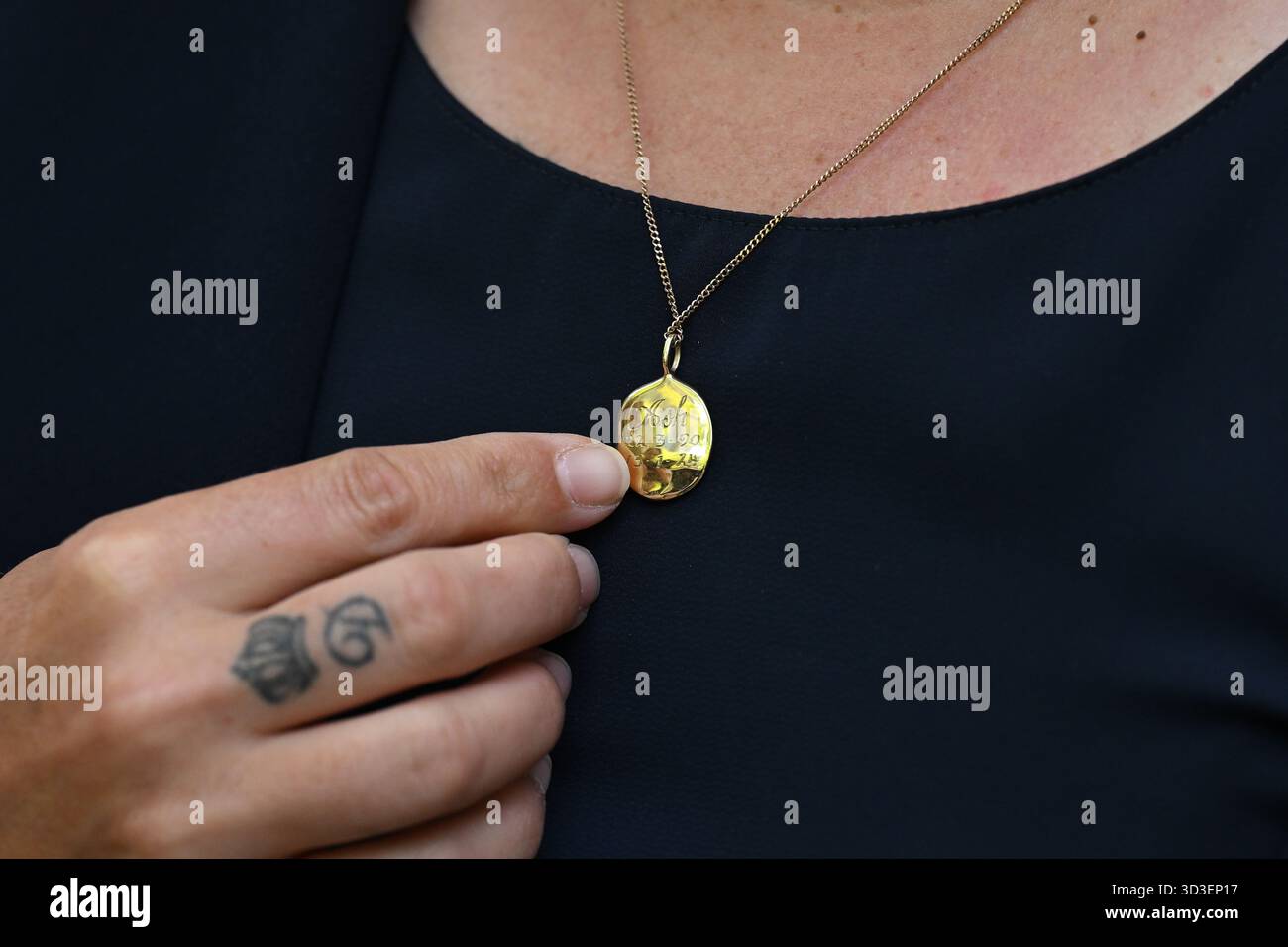 Detail image of Natalie Gordon, sister of victim Ashley Gordon holding ...