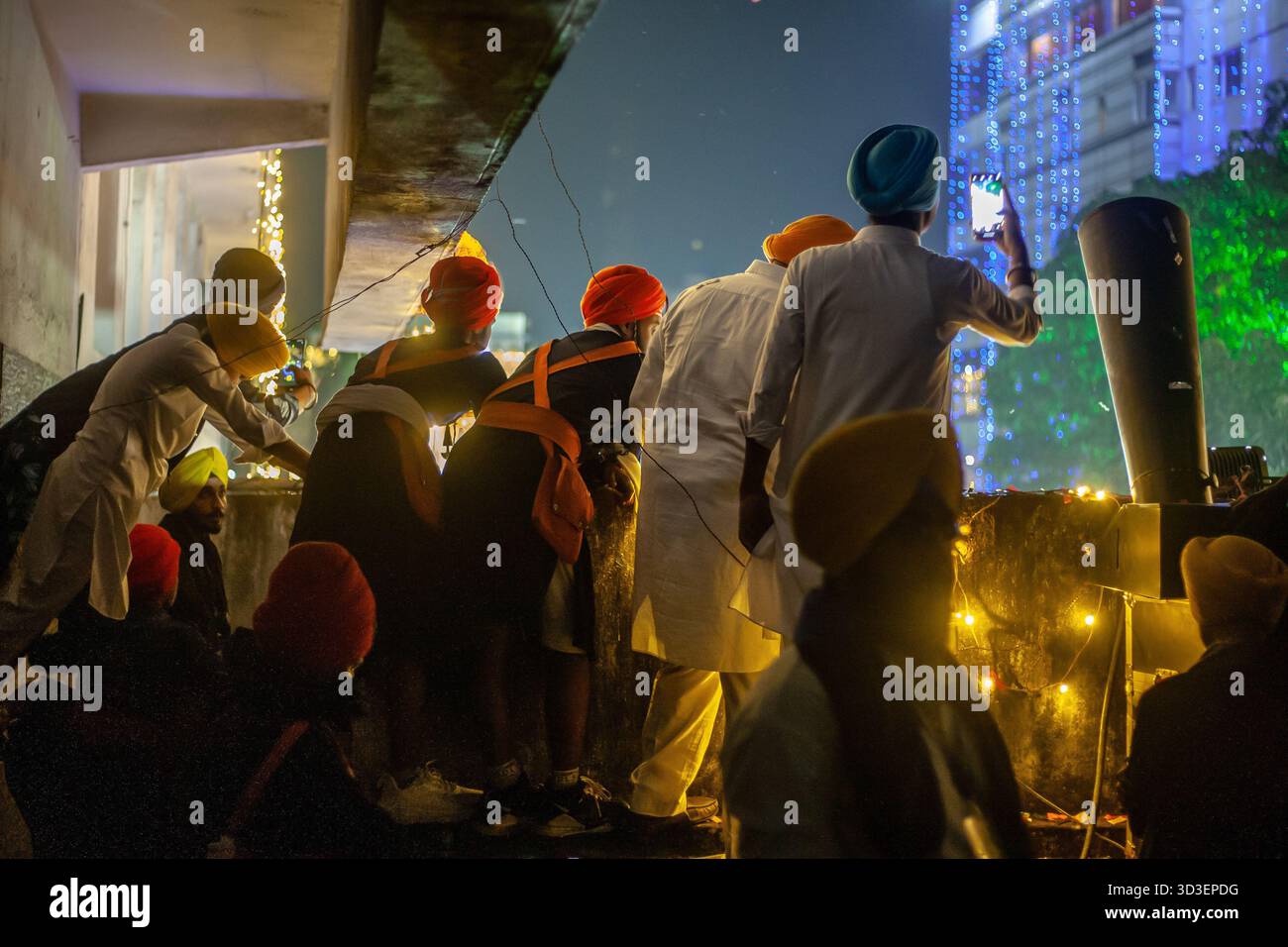 Sikh devotees look down from the terrace of the central Gurudwara in ...