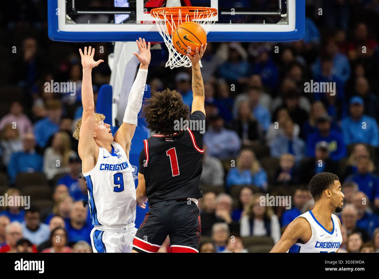 Creighton guard Ty Davis (9) defends against a shot by South Dakota ...