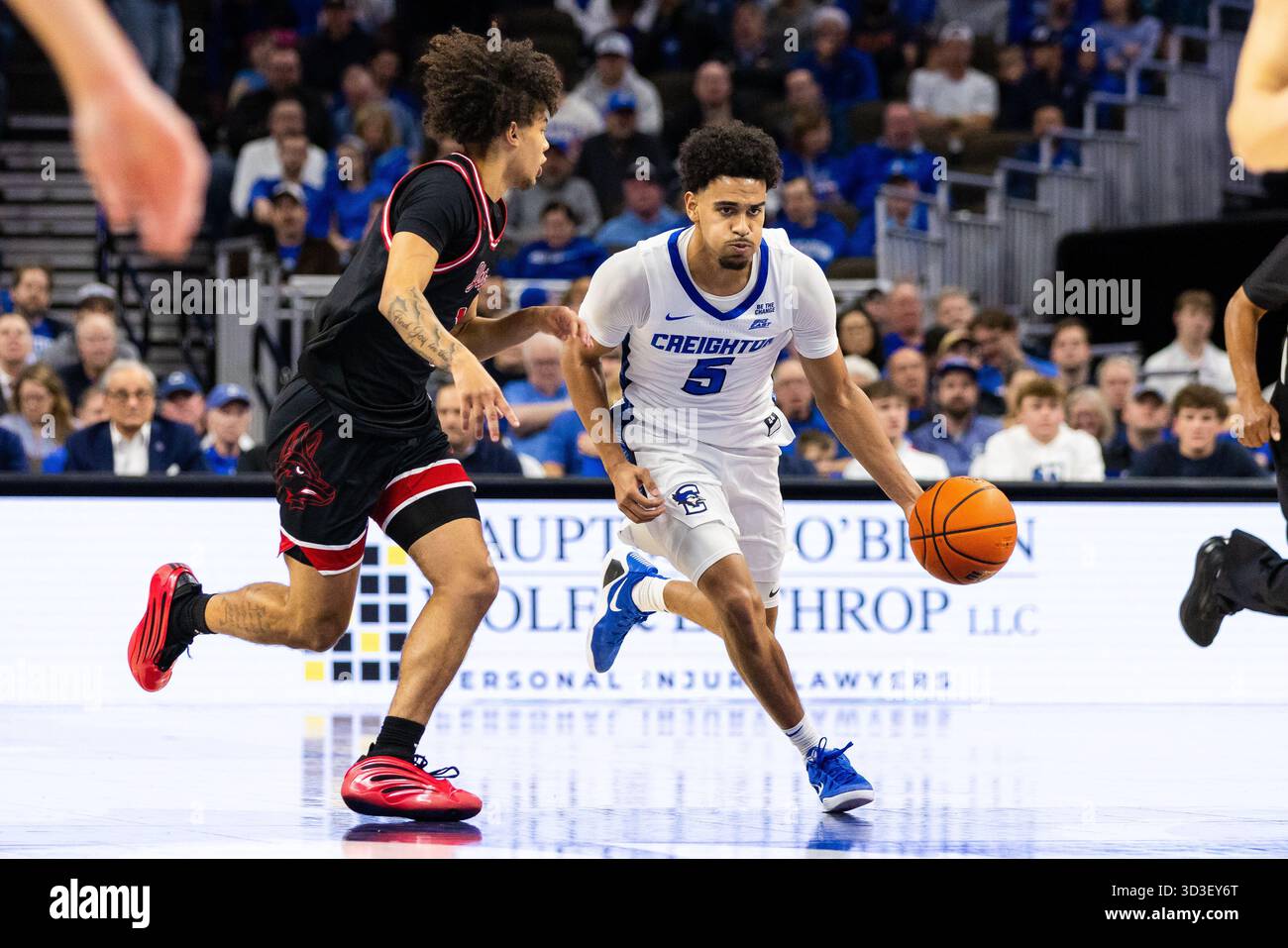 Creighton guard Nik Graves (5) brings the ball up the court against South Dakota guard Uzziah ...
