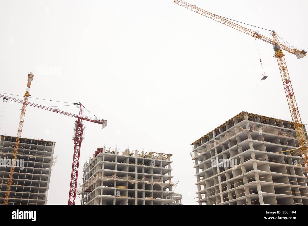 A bustling Construction Site showcasing Cranes, Building Framework, and ...