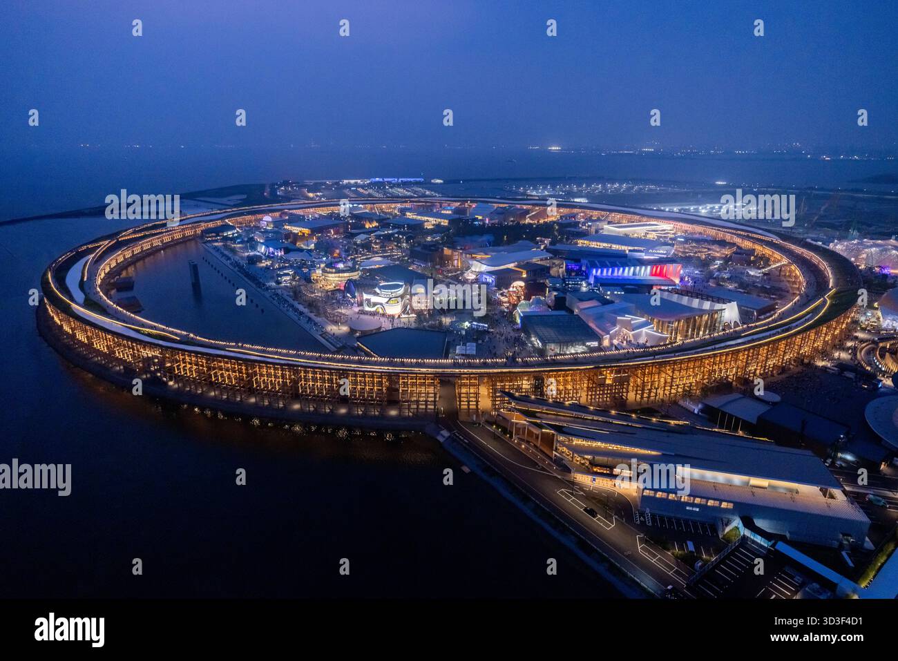 Aerial view of Expo 2025 Osaka Japan at dusk, night on Yumeshima Island ...