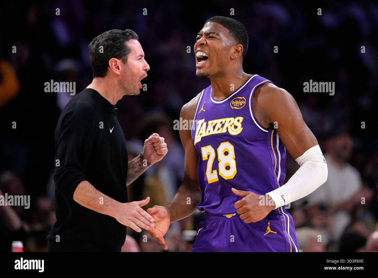 Los Angeles Lakers forward Rui Hachimura, right, celebrates with head ...