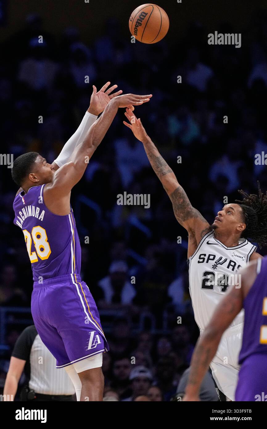 Los Angeles Lakers forward Rui Hachimura, left, shoots as San Antonio ...