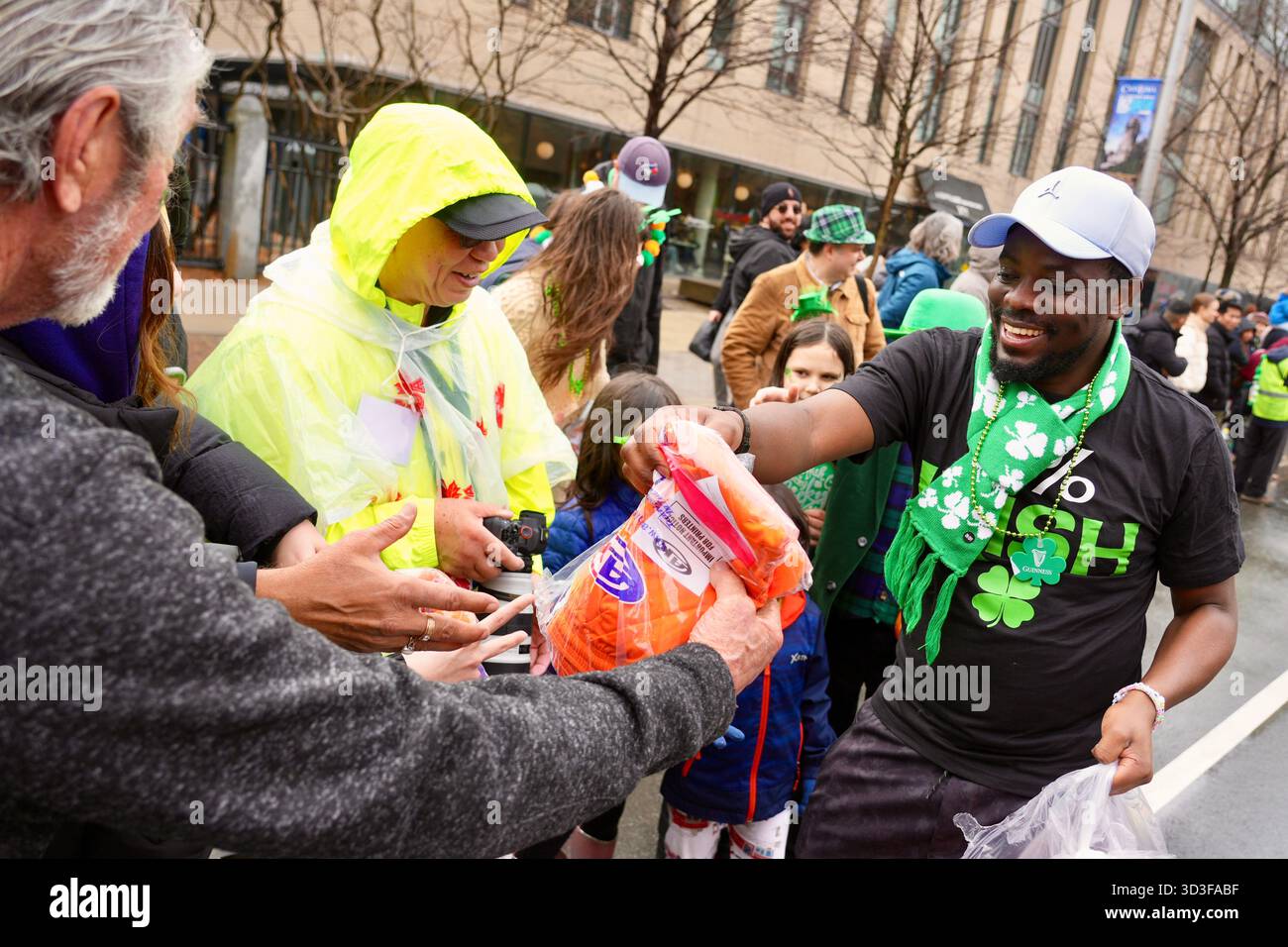 Parade participants handing out stuff while marching in the St. Patrick ...