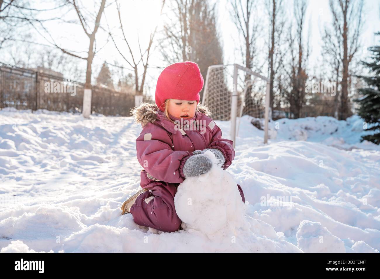 Cute little child girl toddler in winter in a snowy forest, outdoor ...