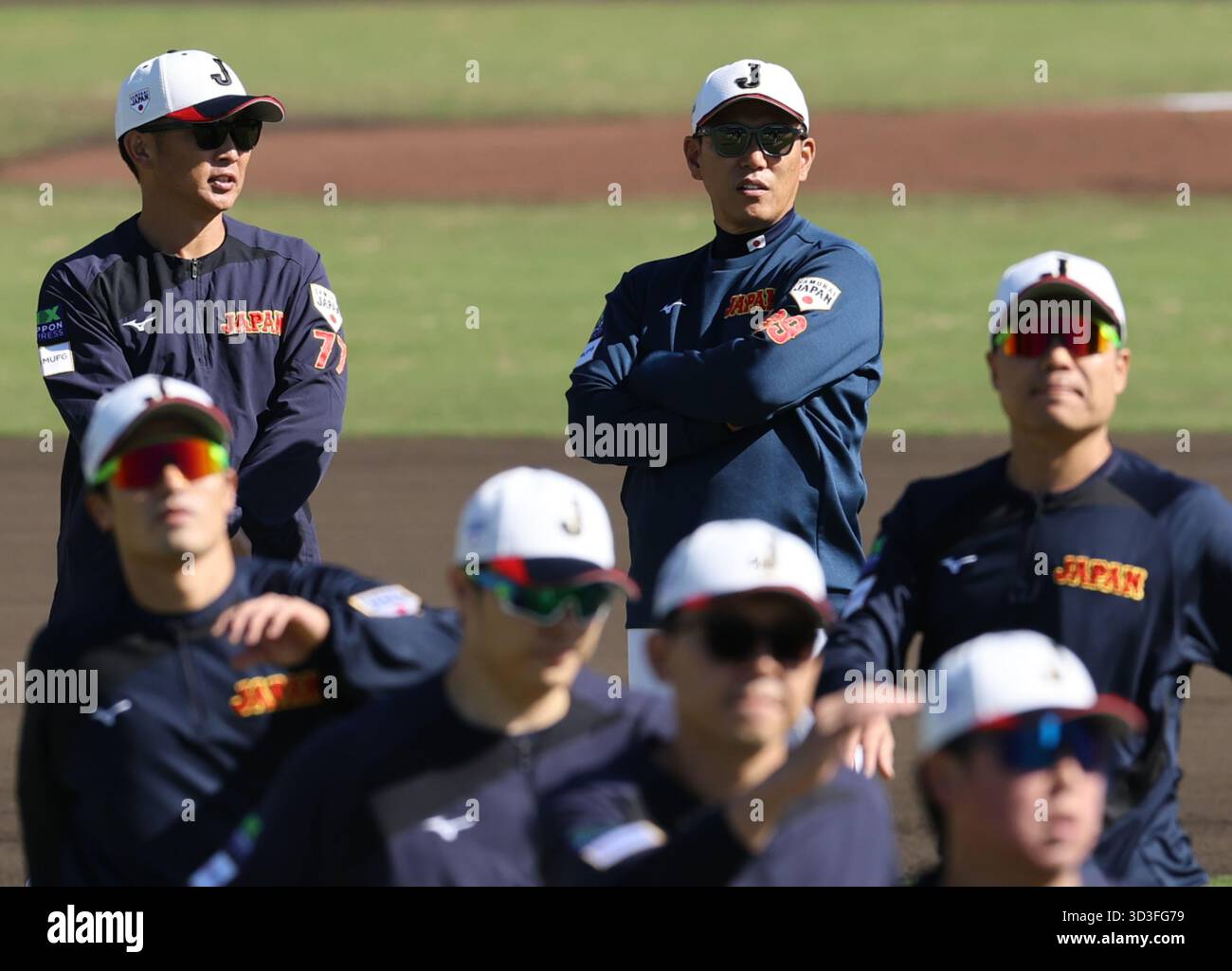 Japan's national baseball team manager Hirokazu Ibata watches players ...
