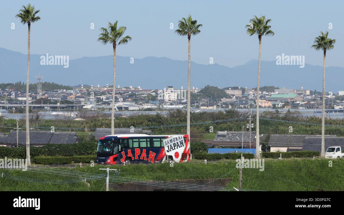 A photo shows a Samurai Japan-themed wrapped bus running through ...