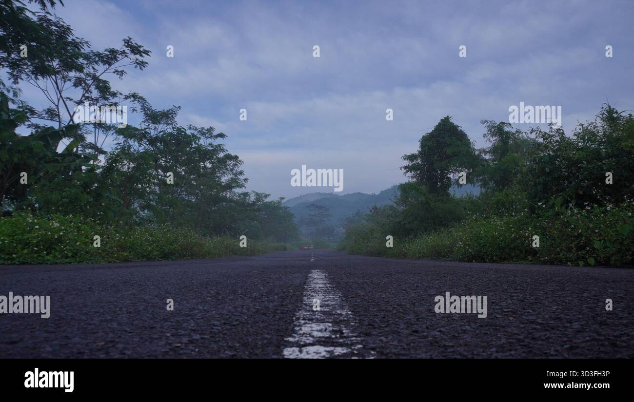 Paved road through mountains hi-res stock photography and images - Alamy
