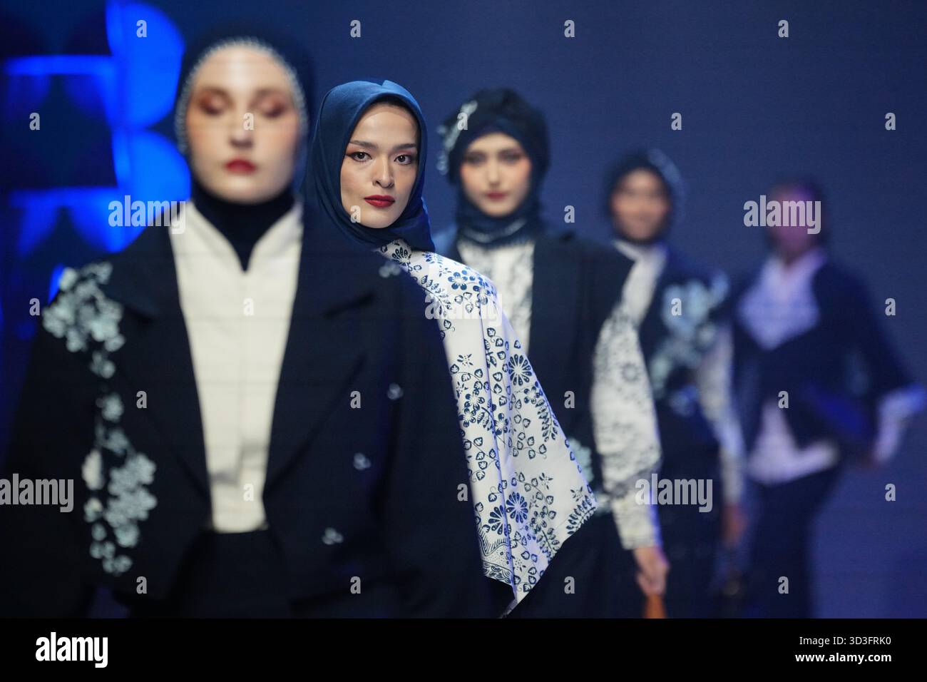 Models present a creation by Indonesian fashion designer Dama Kara ...