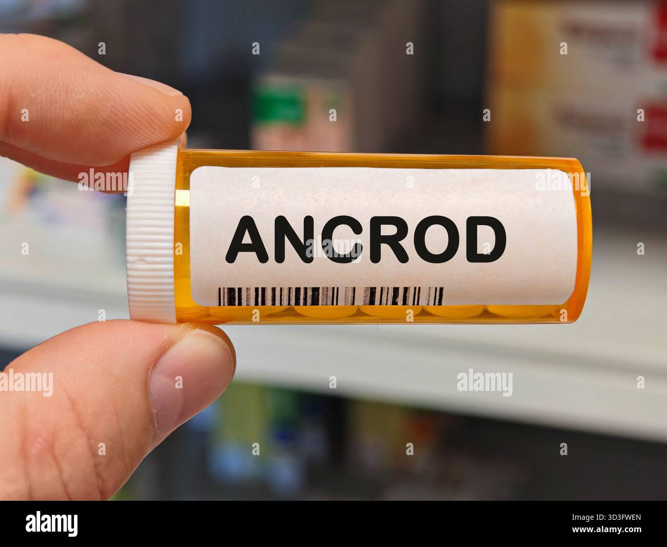 orange plastic Box of ANCROD tablets on a hospital pharmacy table used ...
