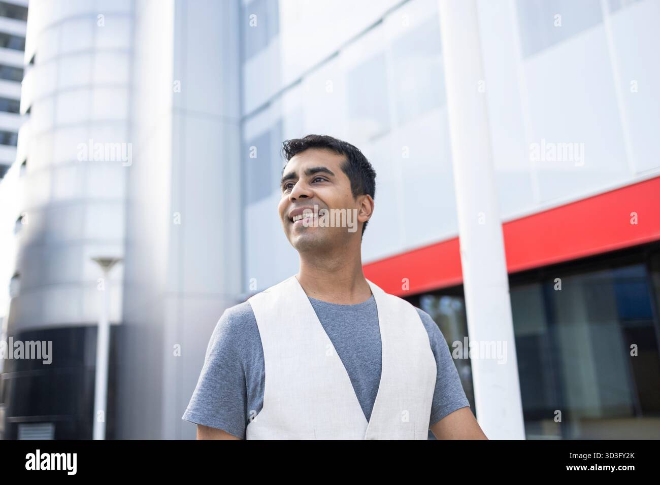 Hispanic man smiles confidently hi-res stock photography and images - Alamy