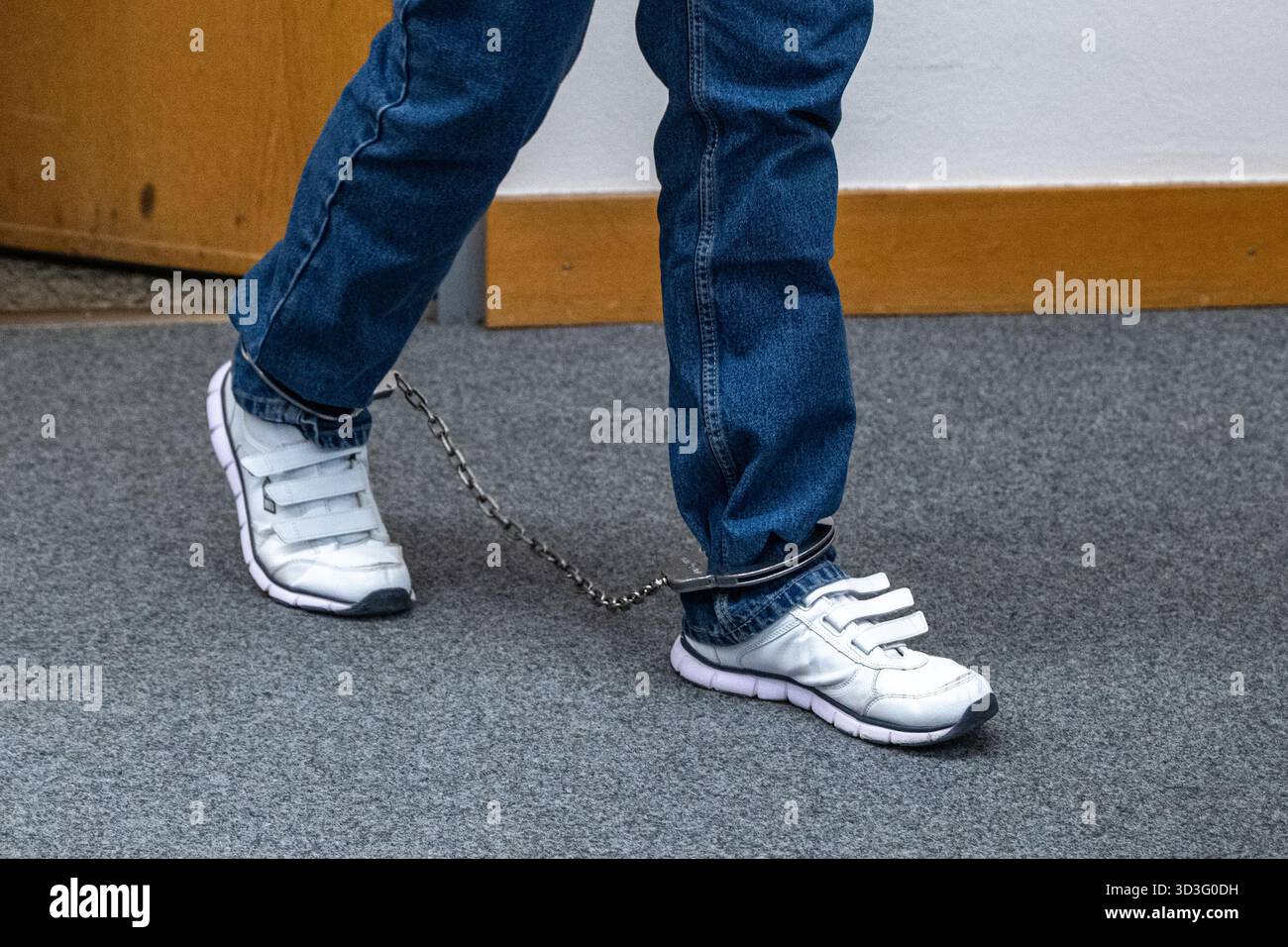 06 November 2025, Bavaria, Landshut: The defendant enters the courtroom ...