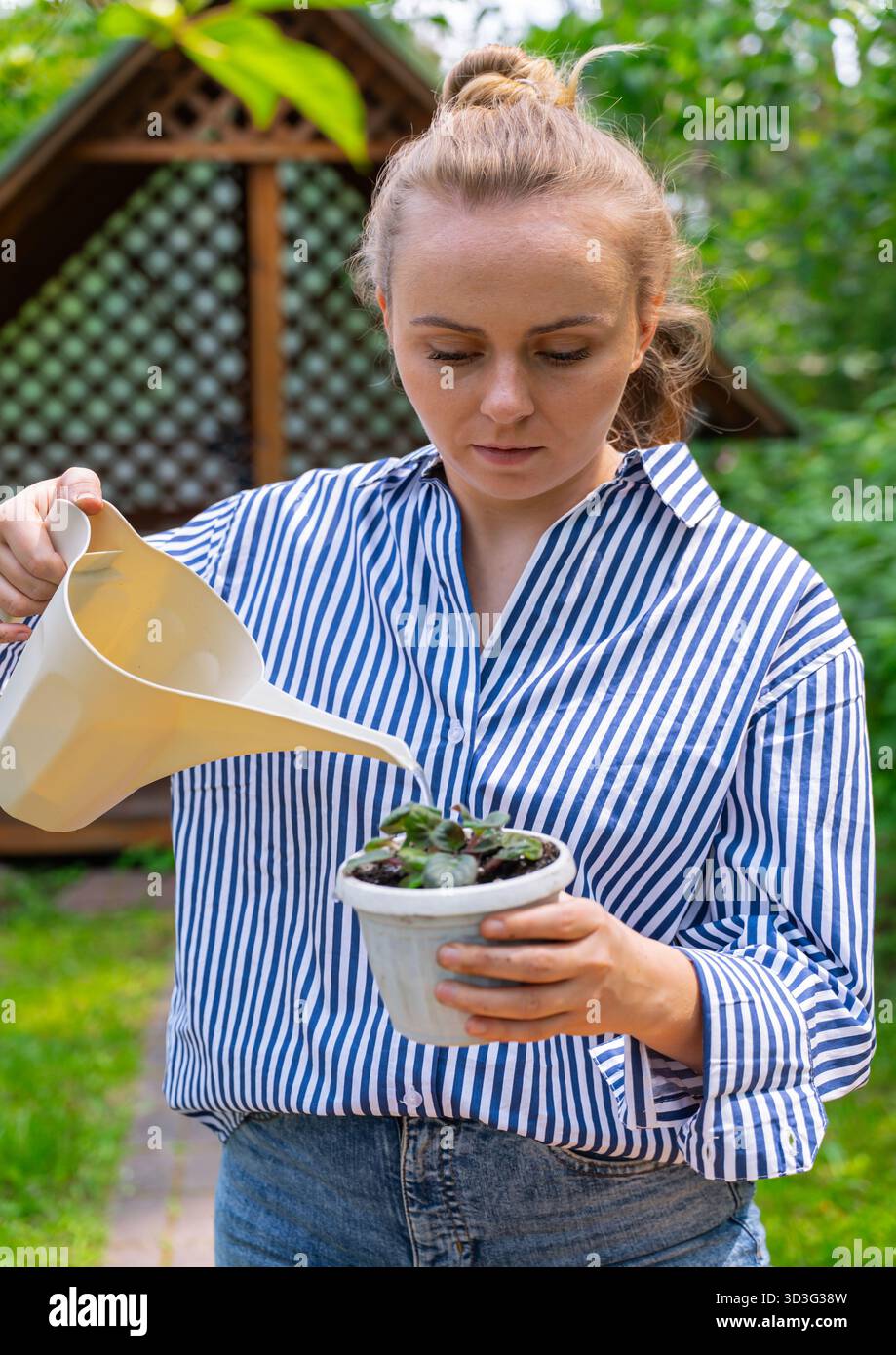 Focused woman in striped shirt hi-res stock photography and images - Alamy